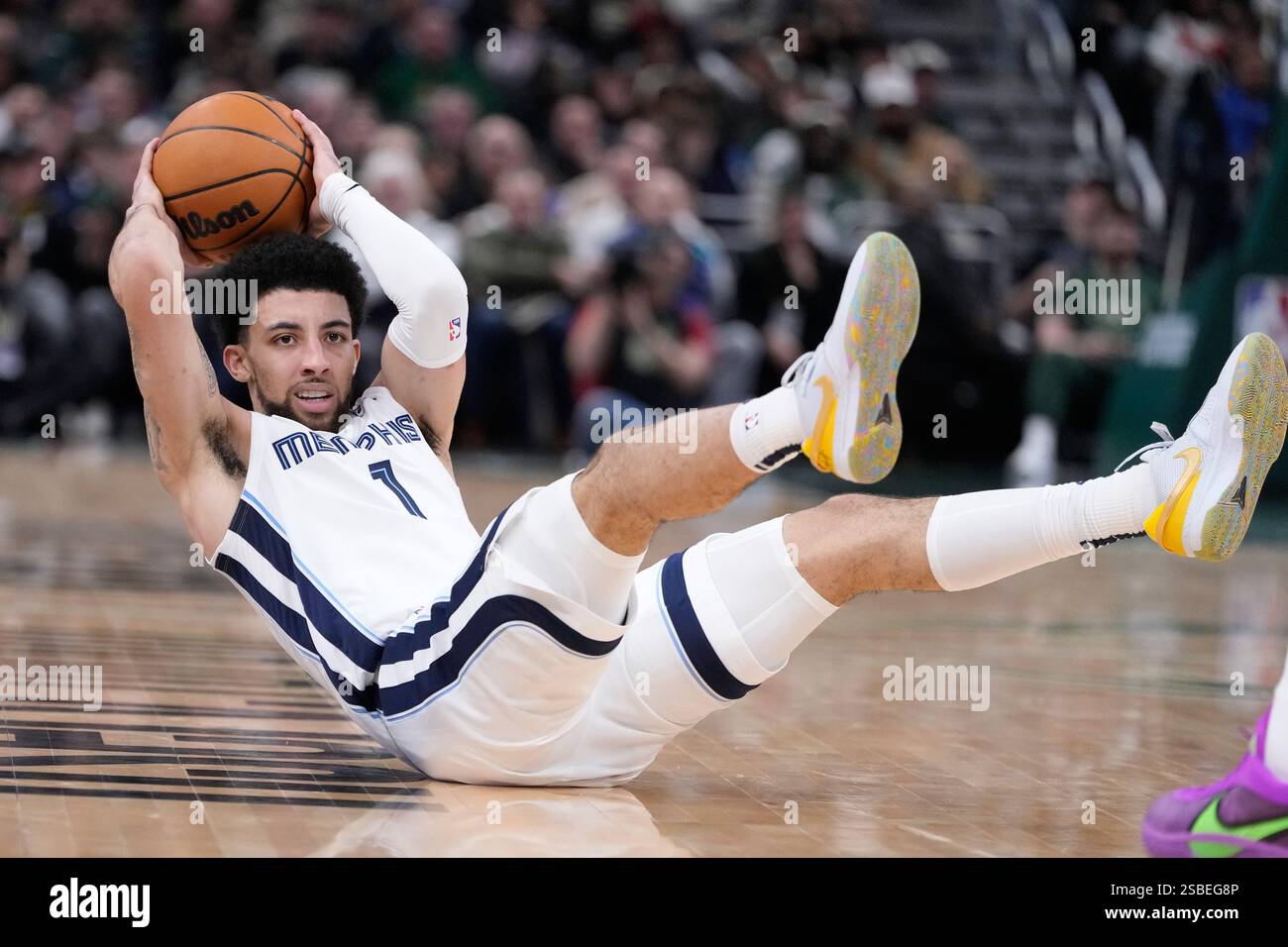 Memphis Grizzlies' Scotty Pippen Jr. looks to pass from the floor ...