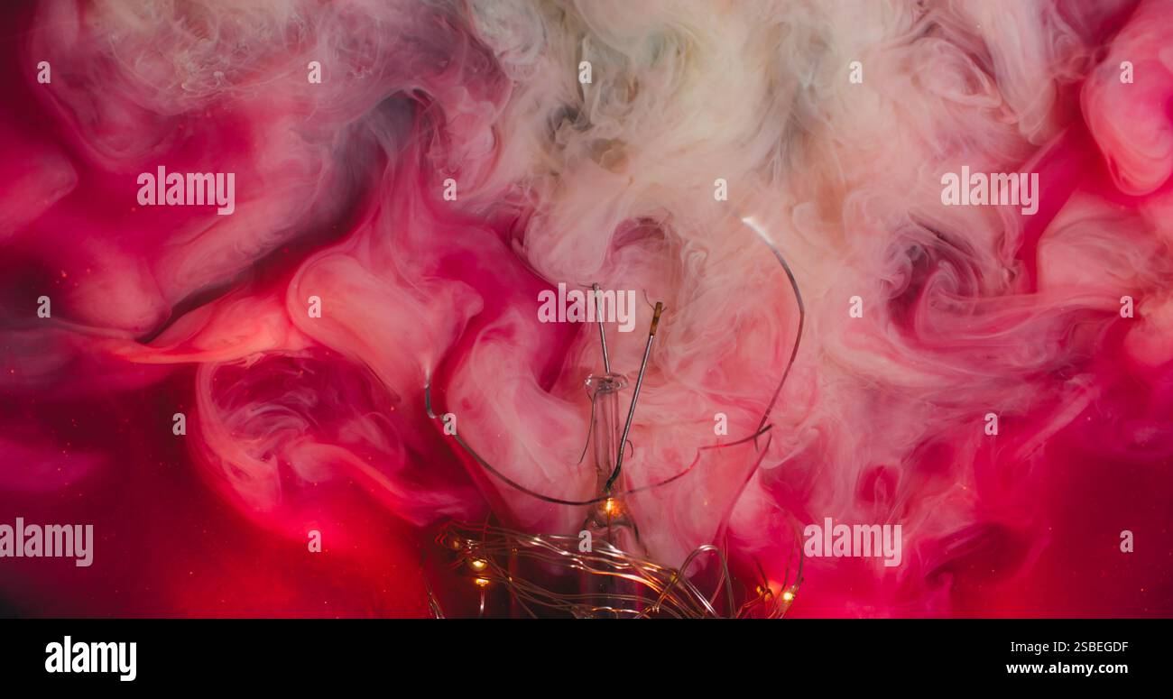 Bright fume. Paint smoke. Exploding red pink cloud ink into white art ...