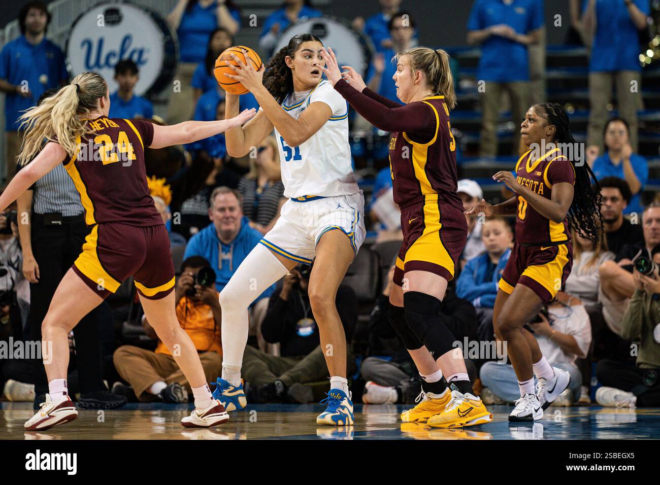 UCLA Bruins center Lauren Betts (51) is triple teamed by Minnesota ...