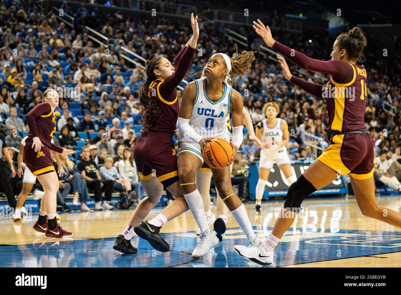 UCLA Bruins forward Janiah Barker (0) is defended by Minnesota Golden ...