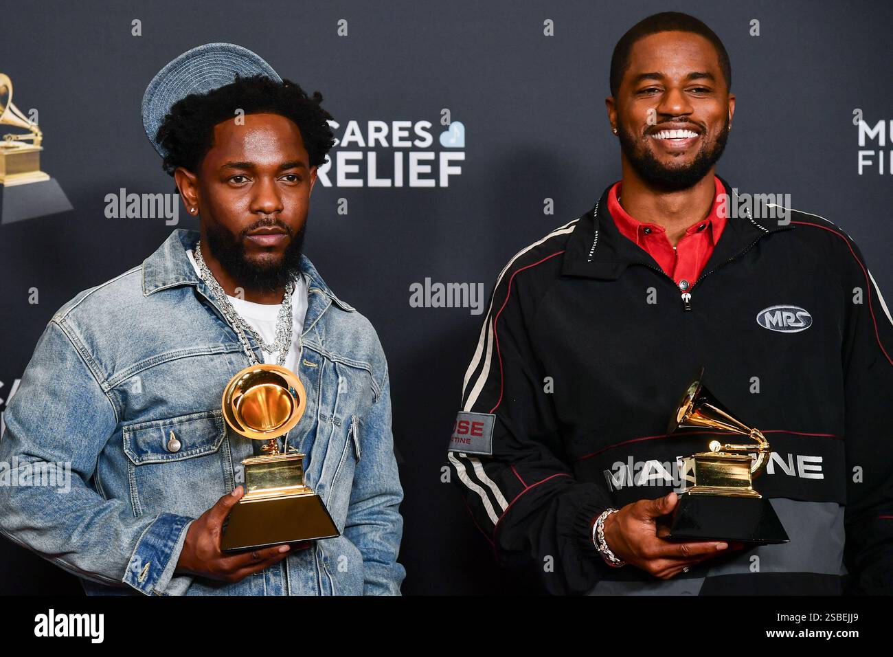 Kendrick Lamar , left, and Dave Free pose in the press room with the ...
