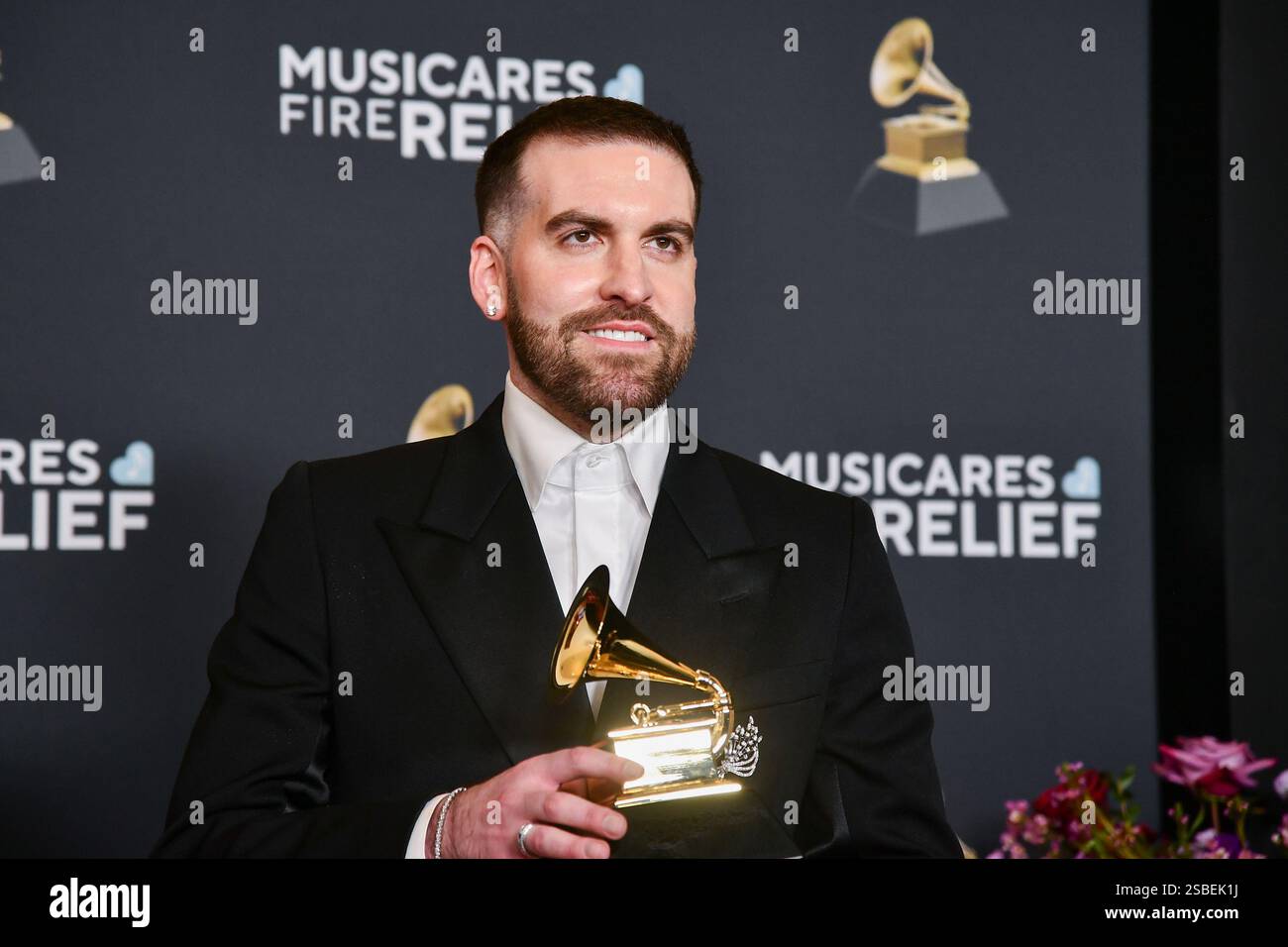 Sean Momberger poses in the press room withe the record of the year ...