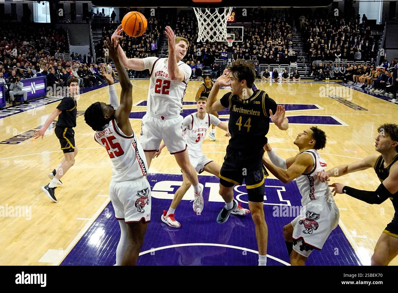 Wisconsin forward Steven Crowl (22) rebounds a ball against ...