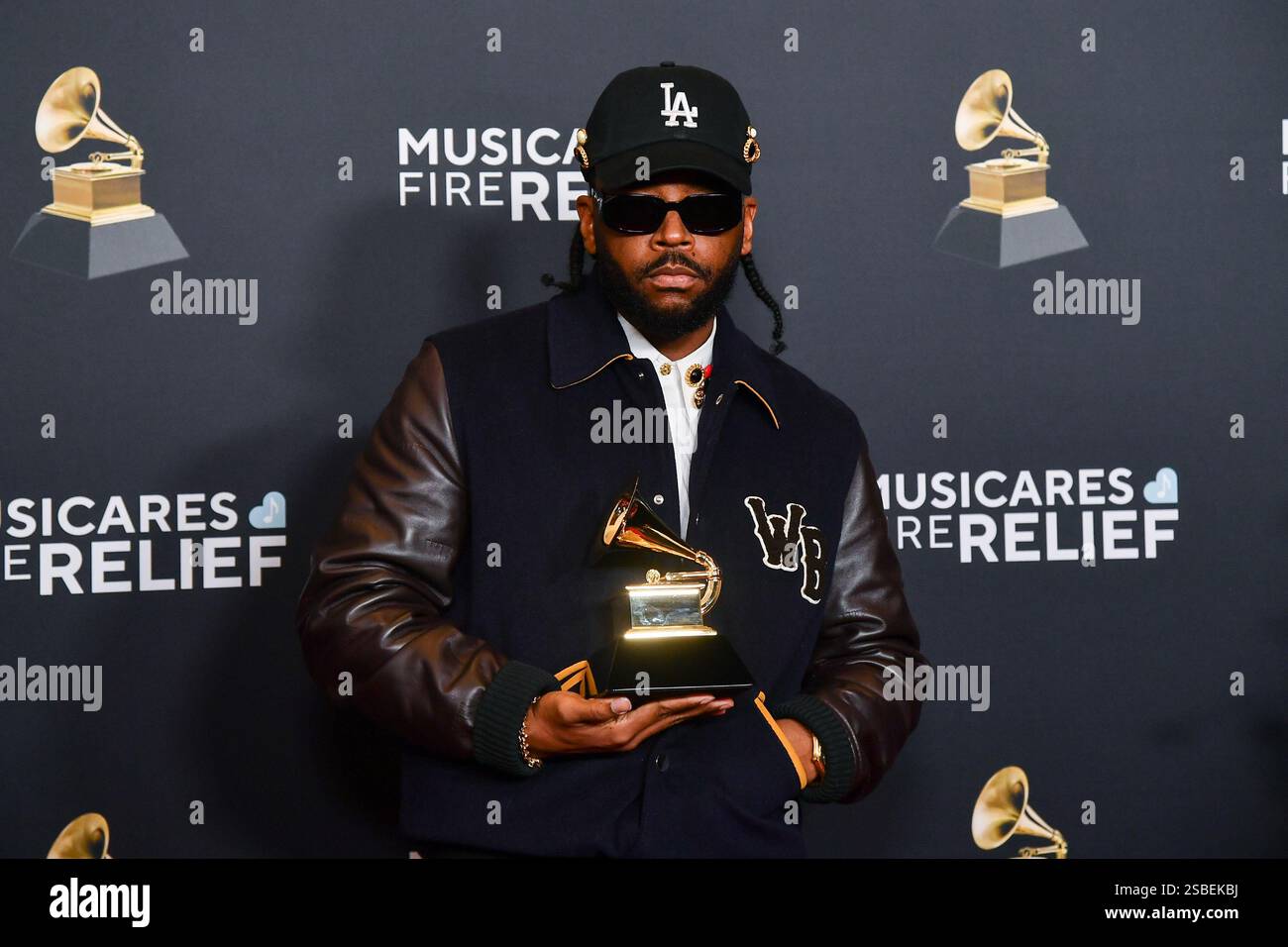 Sounwave poses in the press room with the record of the year award for ...