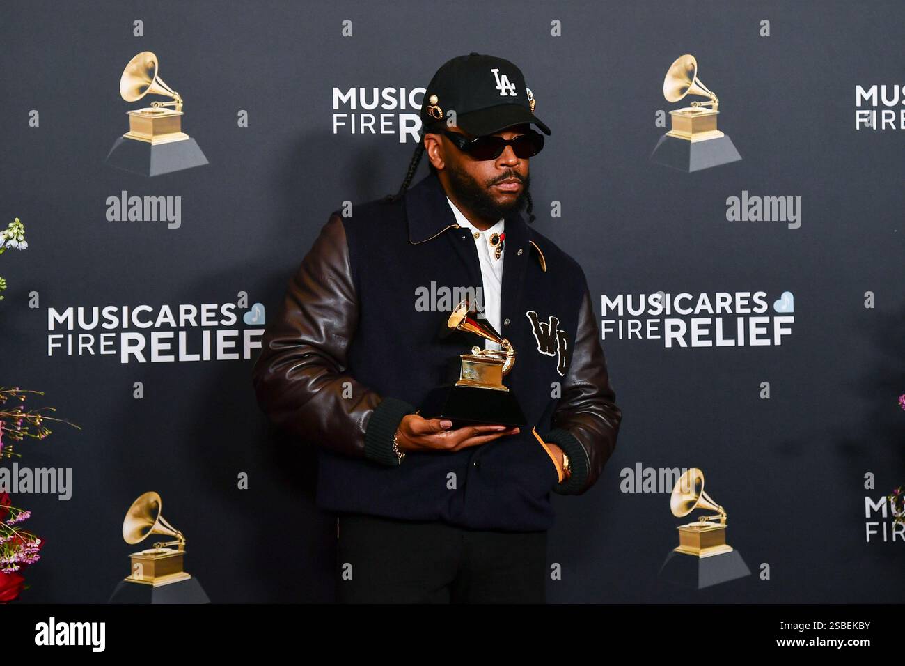 Sounwave poses in the press room with the record of the year award for ...