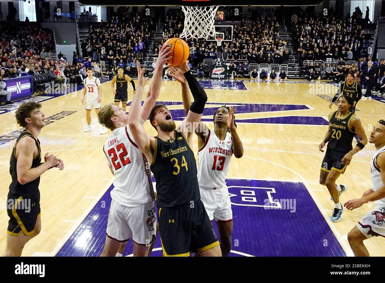 Northwestern center Matthew Nicholson (34) battles for a rebound ...