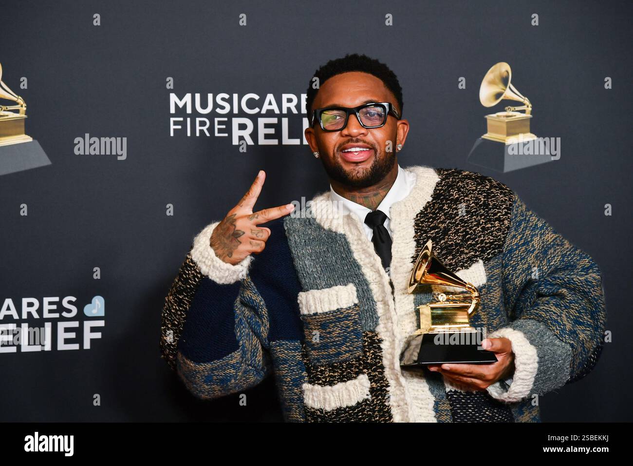 Mustard poses in the press room with the record of the year award for ...