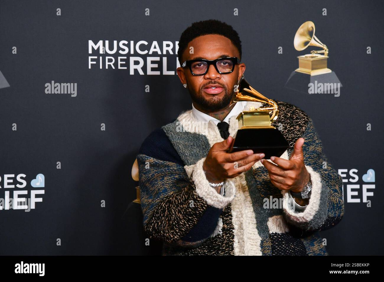 Mustard poses in the press room with the record of the year award for ...