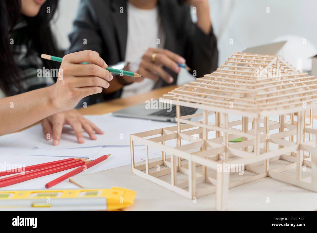 Architect explaining project plan to clients. Confident businesswoman ...