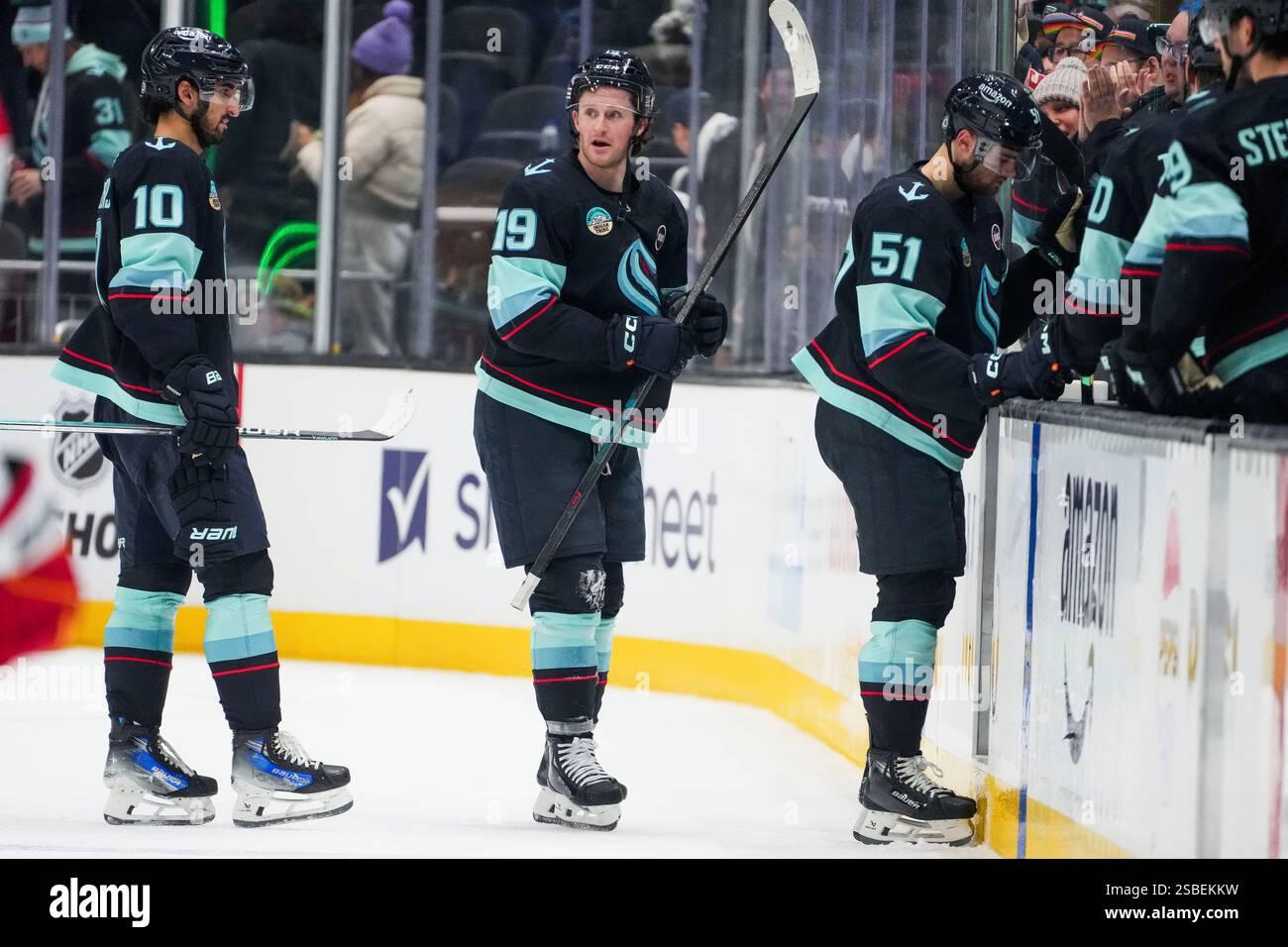 Seattle Kraken center Matty Beniers (10), left wing Jared McCann (19 ...