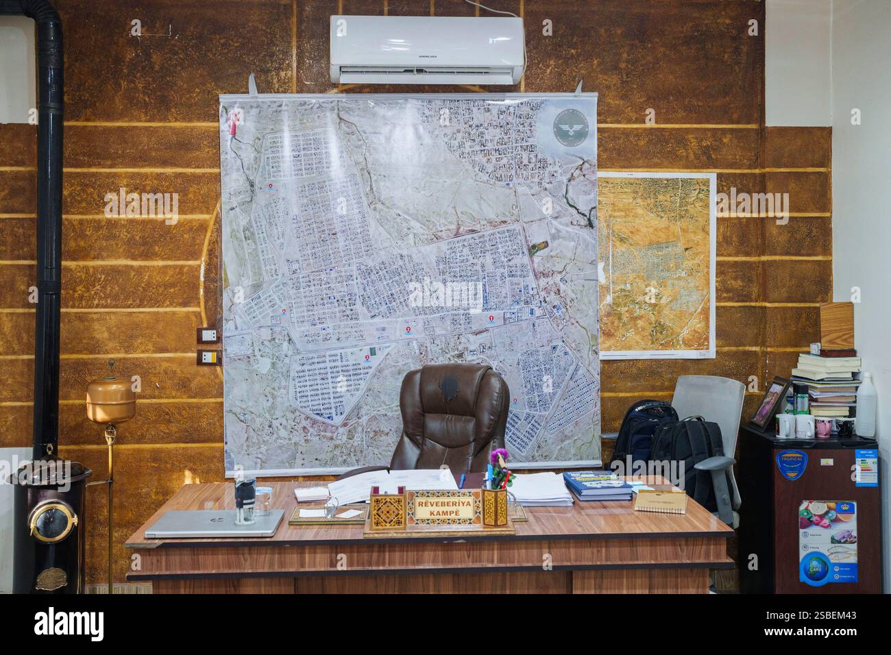 A map of the al-Hol detention camp hangs on the office wall of the camp ...