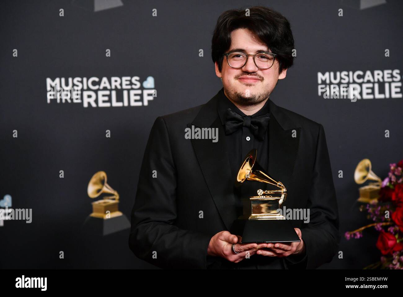 Tom Norris poses in the press room with the award for best dance pop ...