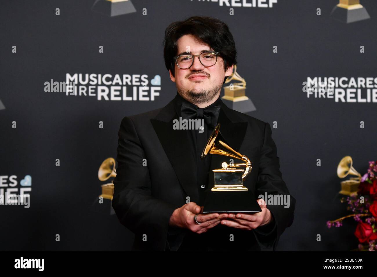 Tom Norris poses in the press room with the award for best dance pop ...