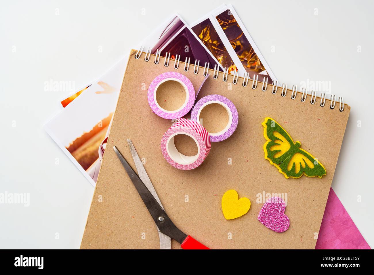 Craft supplies arranged on a table with colorful tape, scissors, and ...