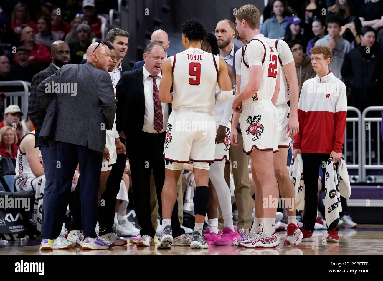 Wisconsin head coach Greg Gard, second from left, talks to players ...
