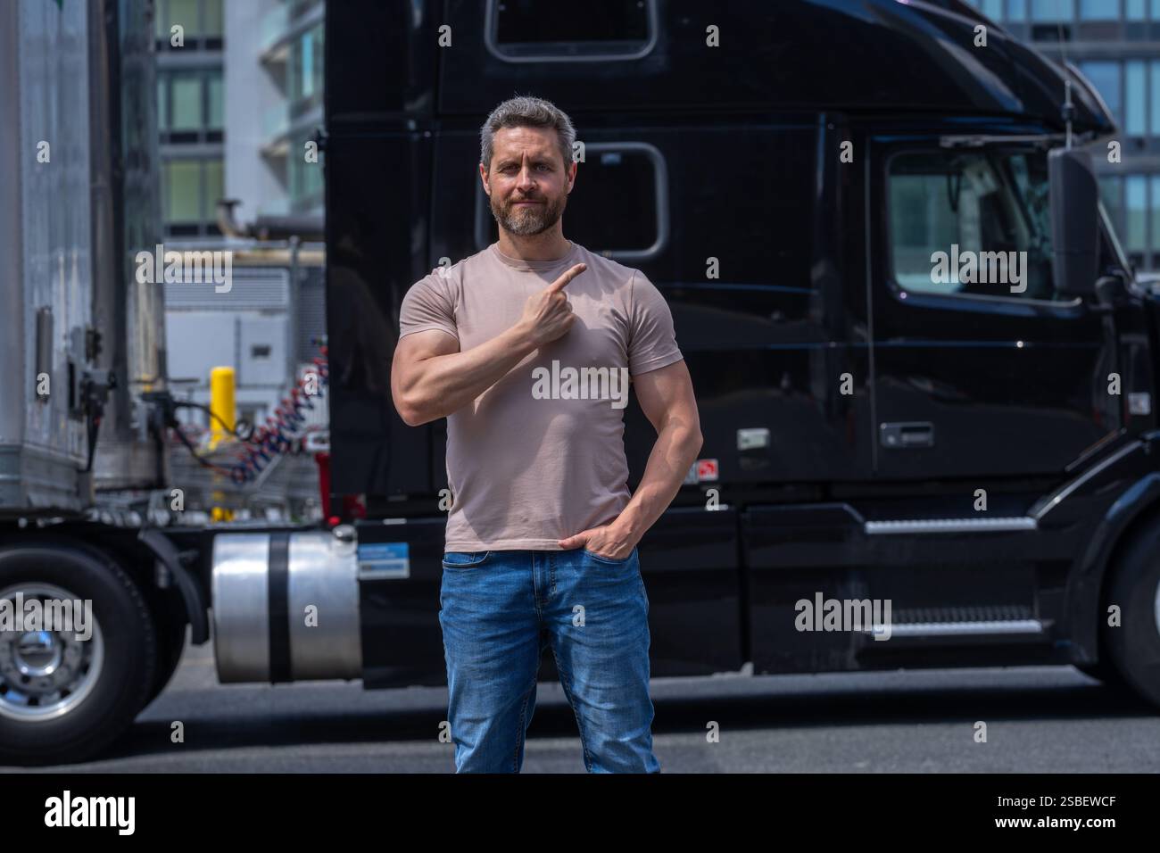 Truck driver. CDL. Portrait of trucker standing by his truck vehicle ...