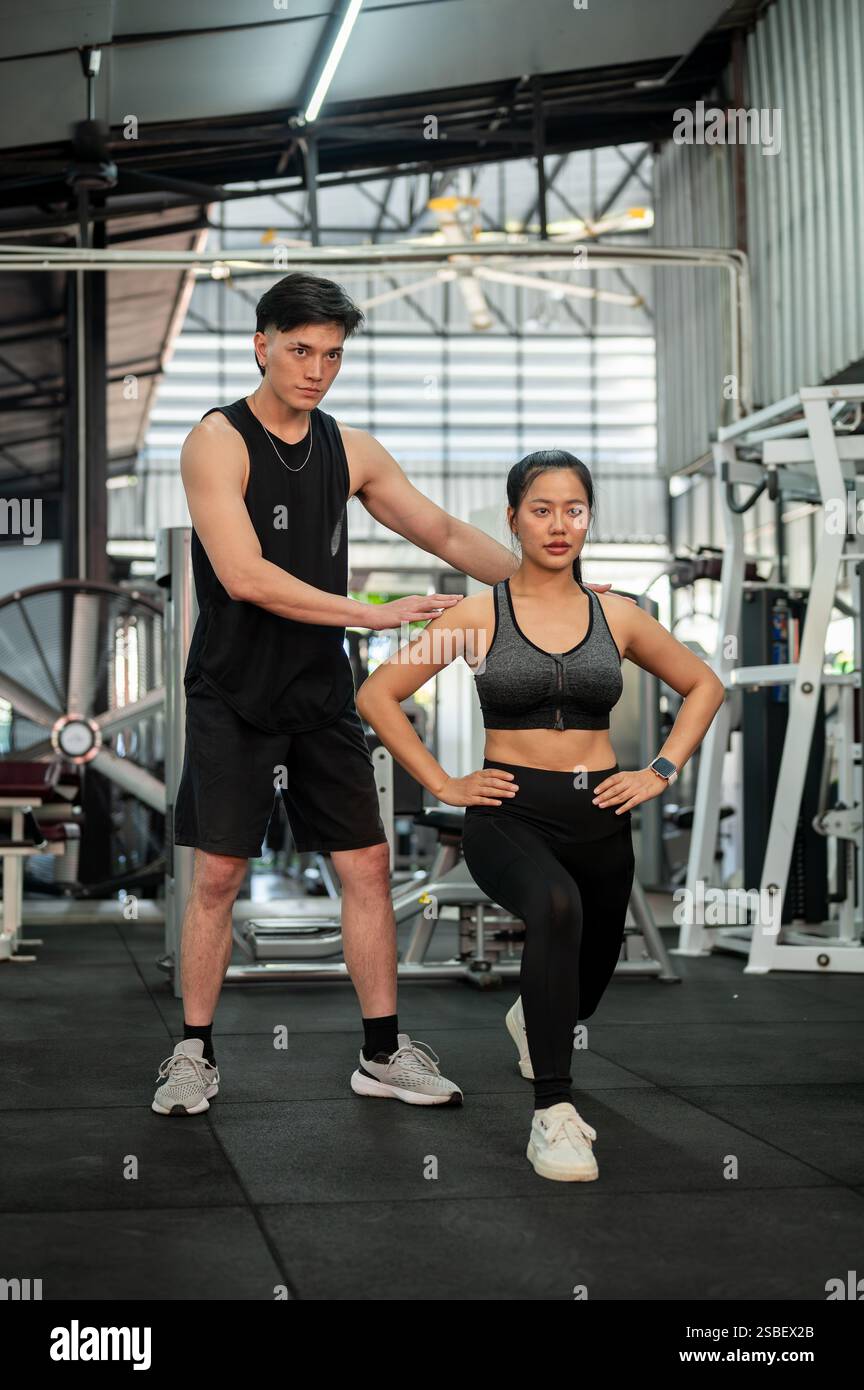 Professional fitness coach checking hi-res stock photography and images - Alamy