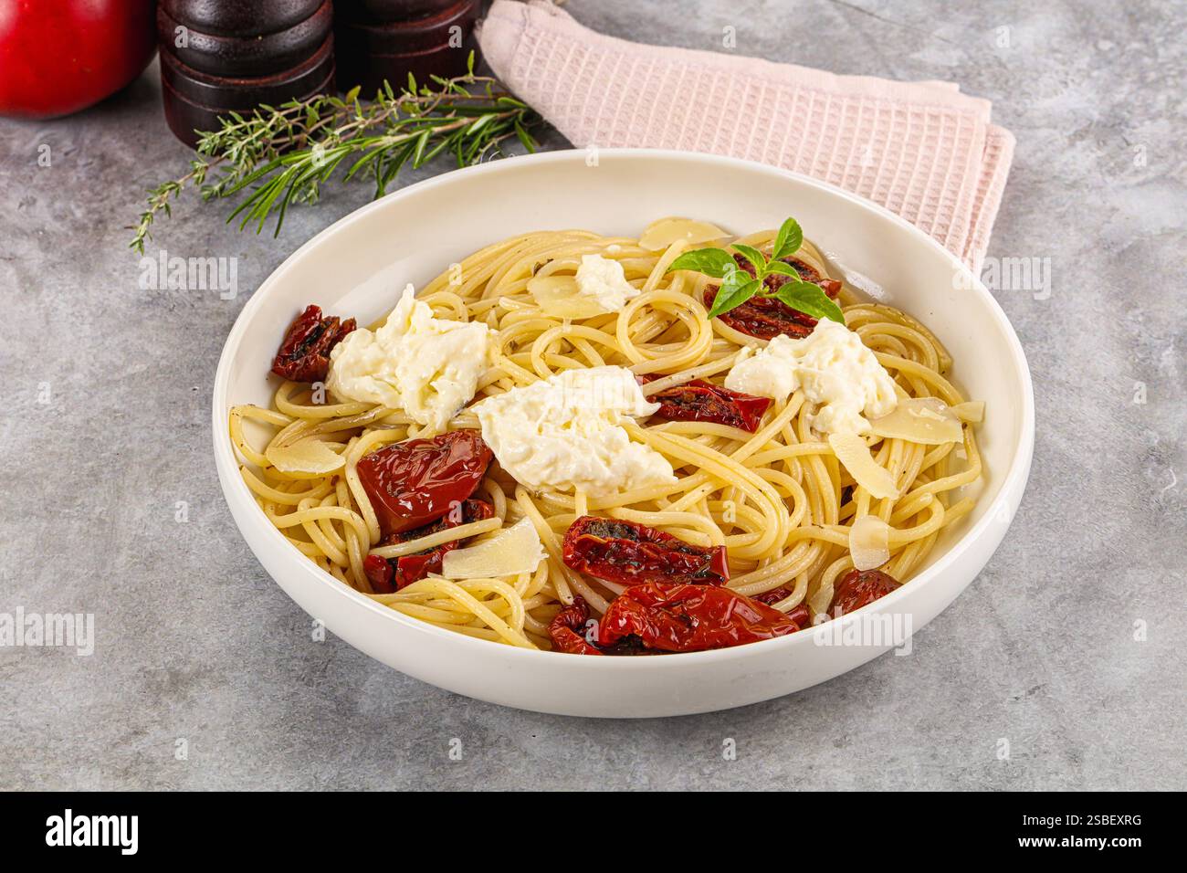 Italian pasta spaghetti with stracciatella and tomato Stock Photo - Alamy