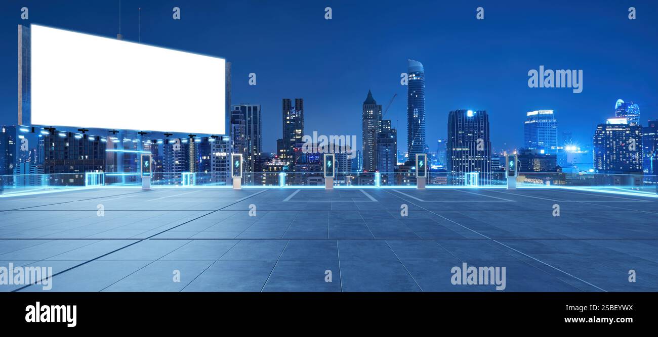 Empty rooftop parking lot with electric vehicle charging stations and a ...