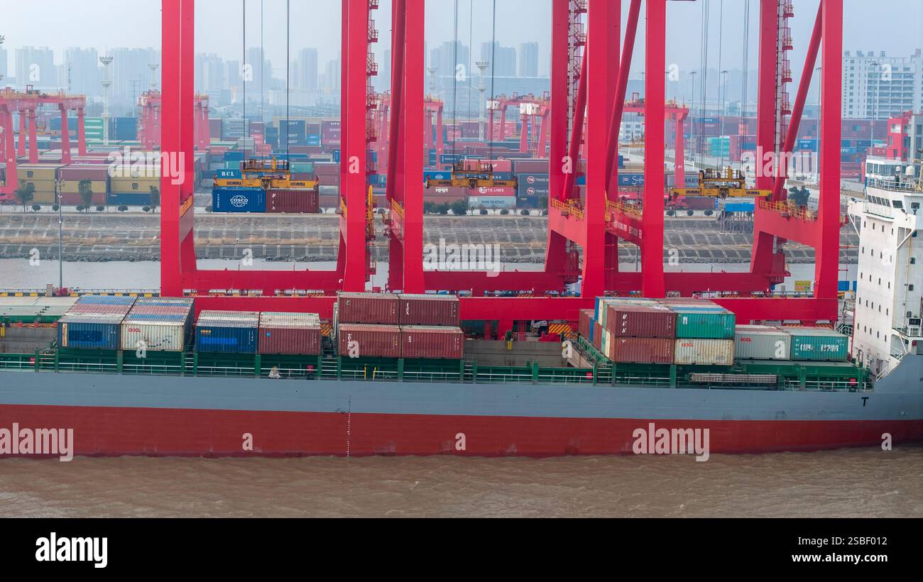 A cargo ship carries out container handling operations at the container ...