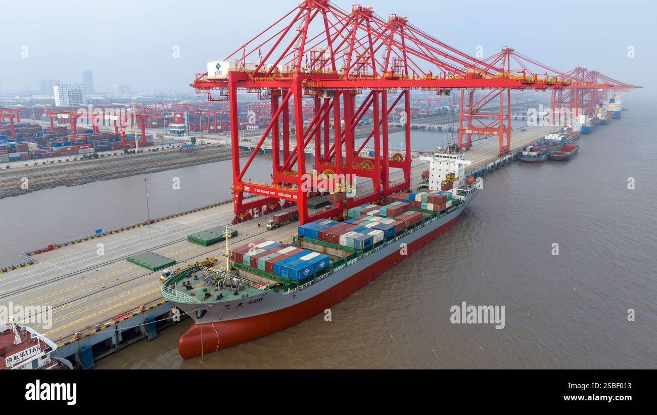 A cargo ship carries out container handling operations at the container ...