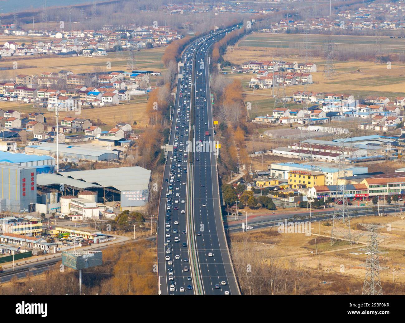 HUAI'AN, CHINA - FEBRUARY 3, 2025 - Vehicles line up and slow down on ...