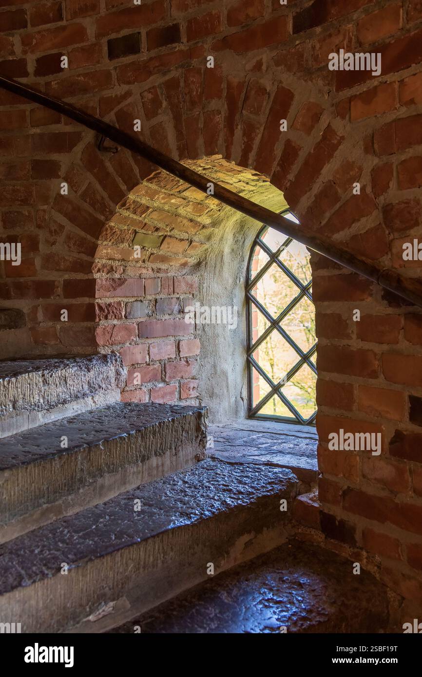 Window niche by the stairs in an old tower of bricks Stock Photo - Alamy