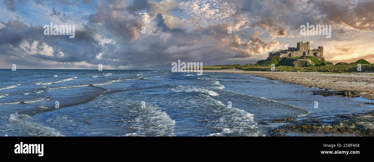 Photo of medieval historic Banburgh castle & beach with sea and waves ...