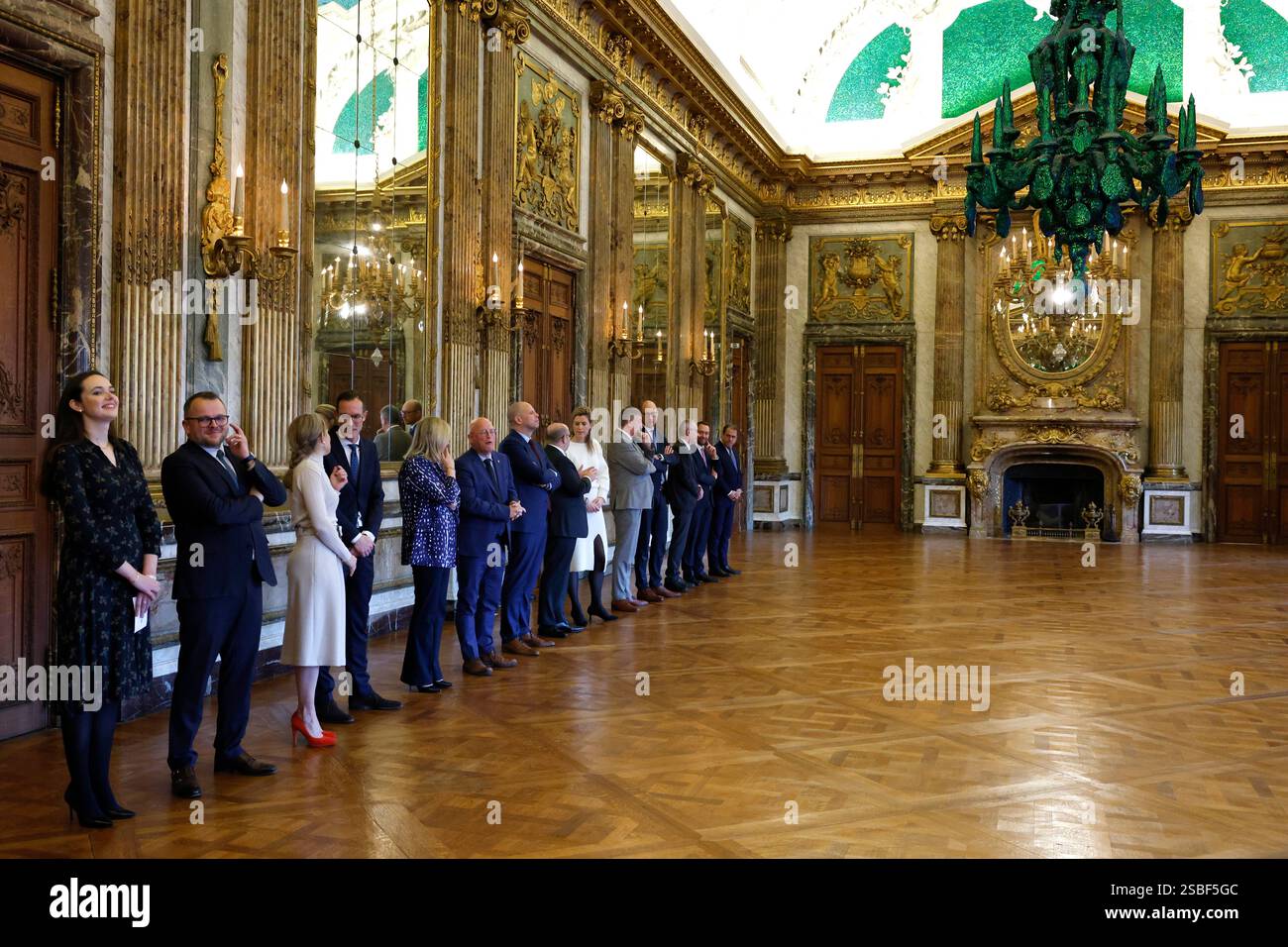 Government ministers stand in a line prior to a swearing in ceremony ...