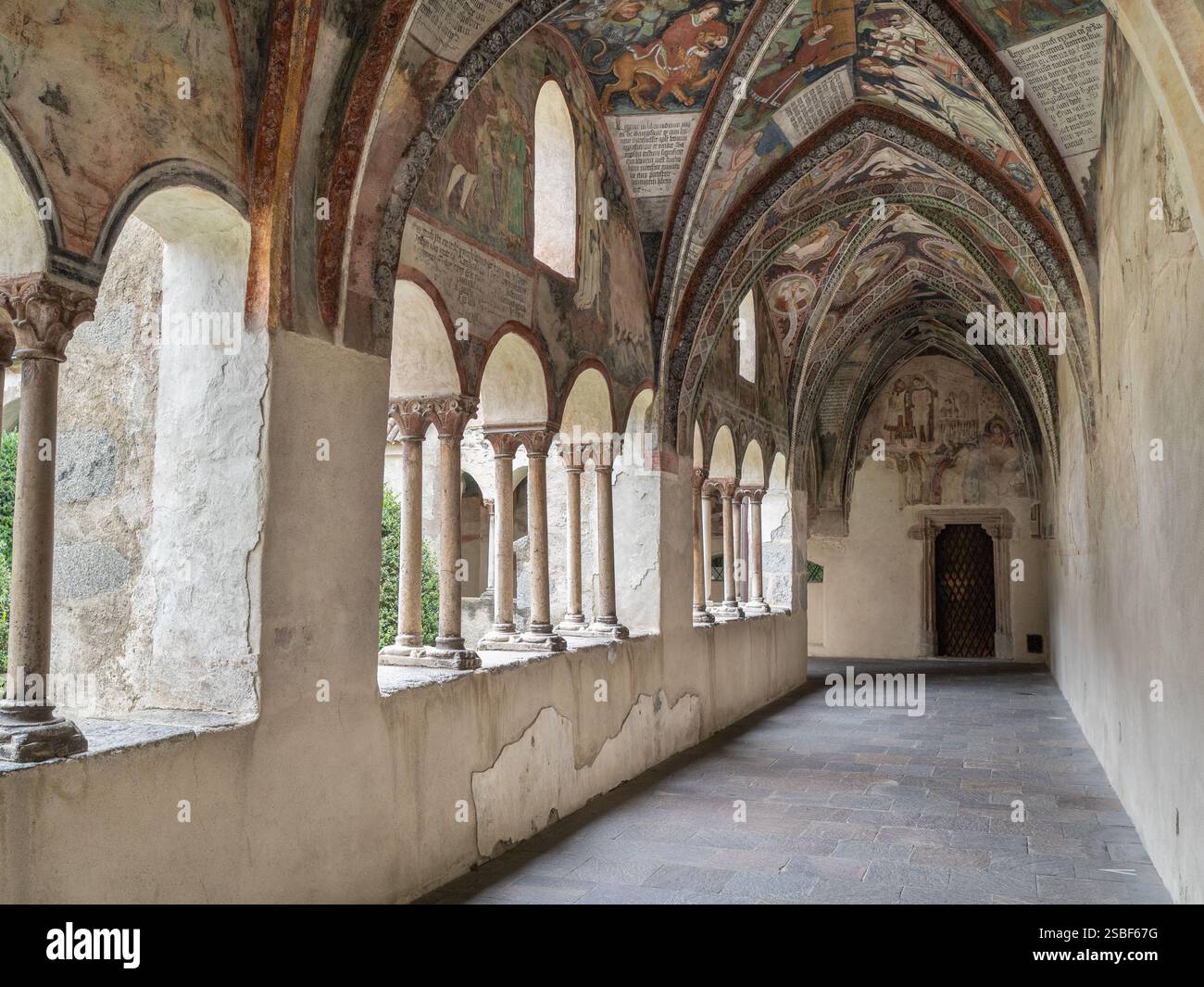 Historic Gothic Cloister Featuring Intricate Murals, Stone Arches and ...