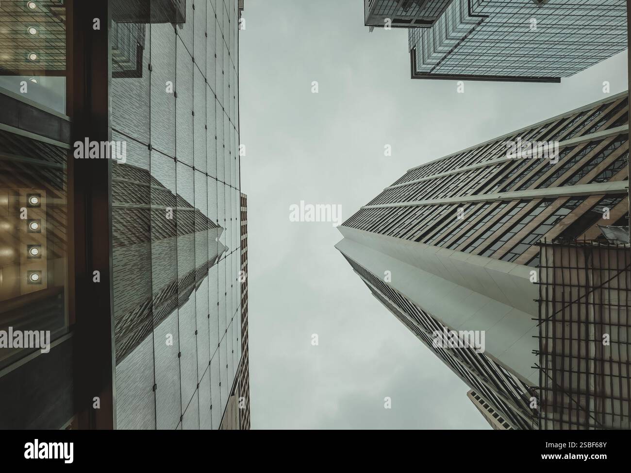A low-angle, close-up shot captures the imposing skyscrapers of Hong ...