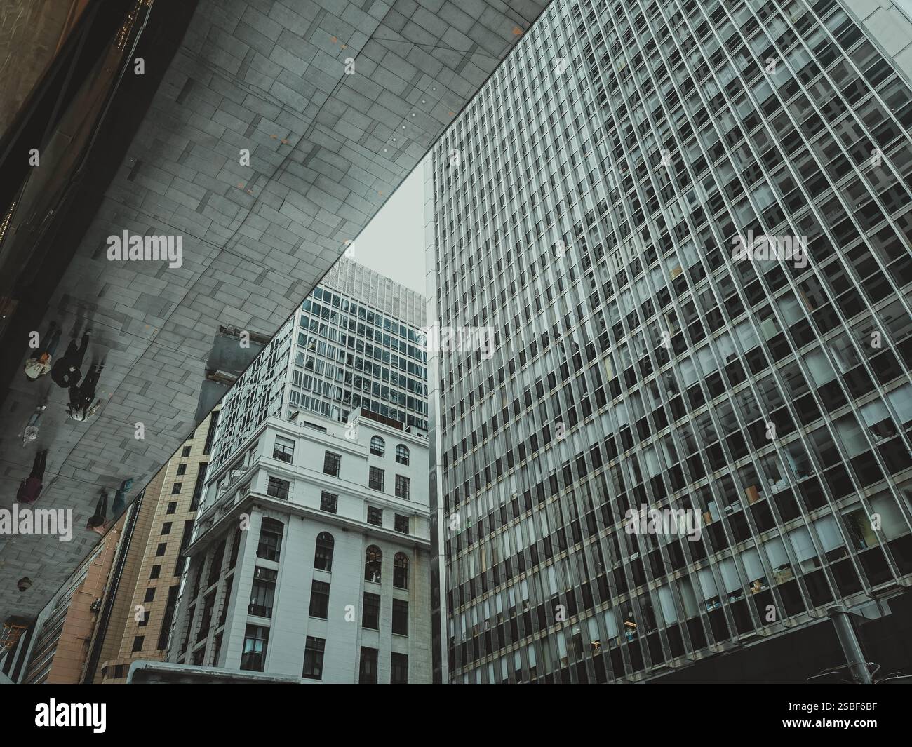 A low-angle, close-up view of towering skyscrapers in Hong Kong ...