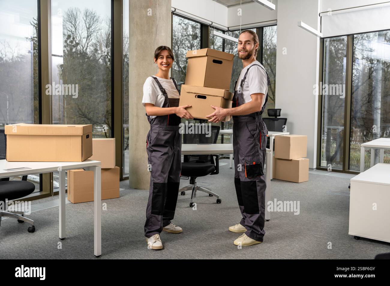 Young people working together with sorting the parcel in a packaging ...
