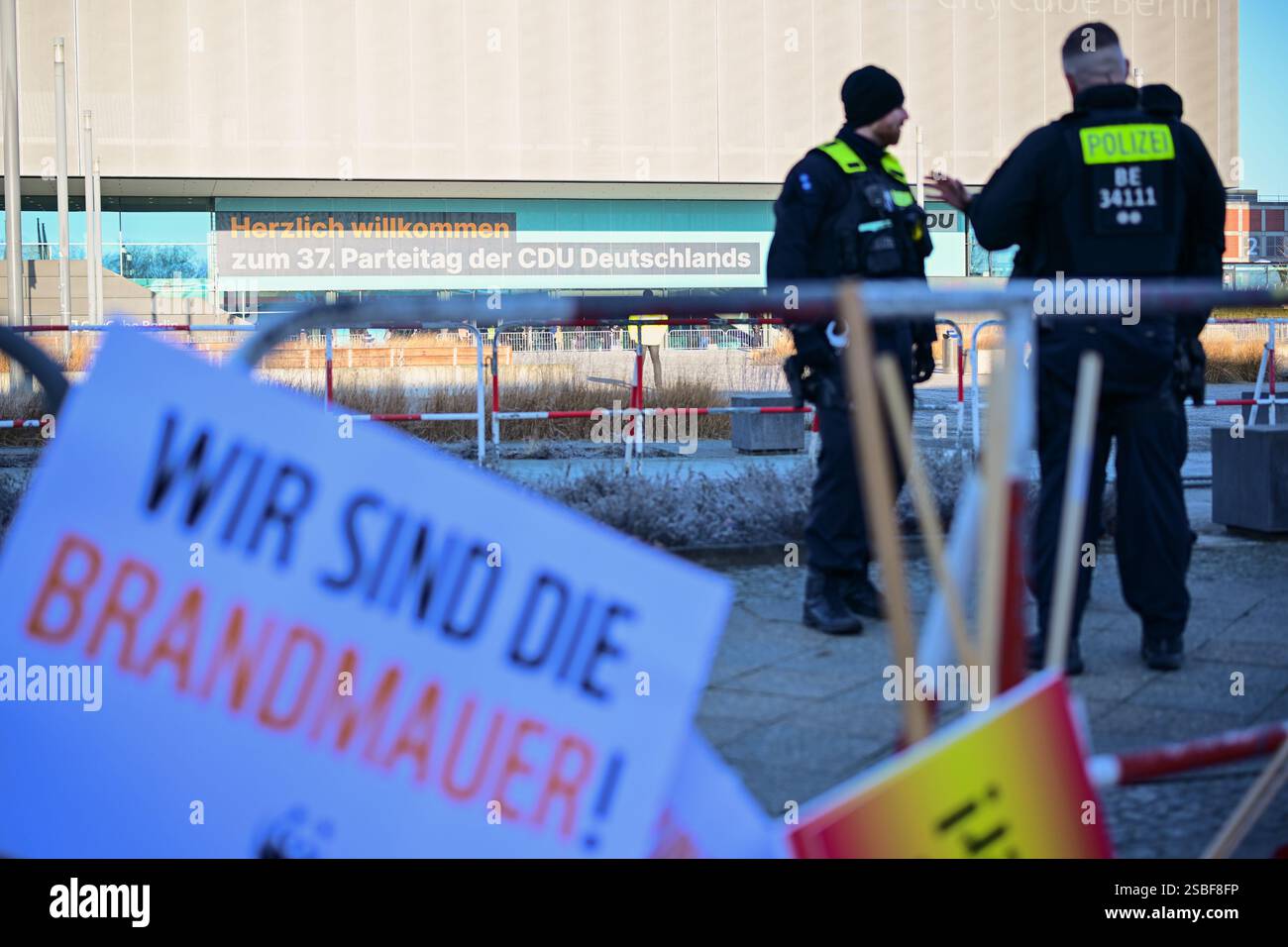 Berlin, Germany. 03rd Feb, 2025. Police officers stand behind barriers ...