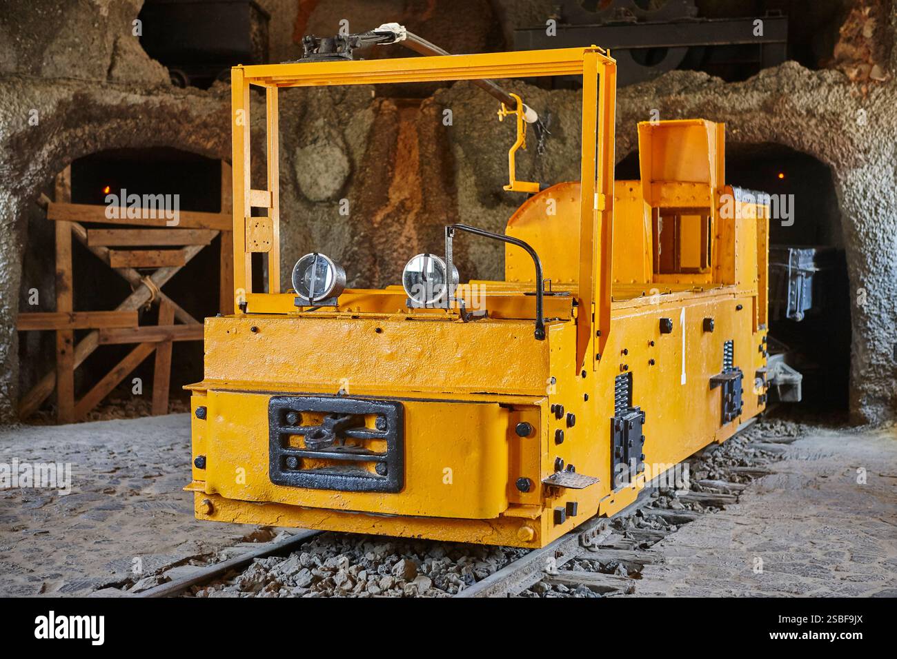 Mining locomotive and wagon transport. Tunnel entrance. Mining industry ...