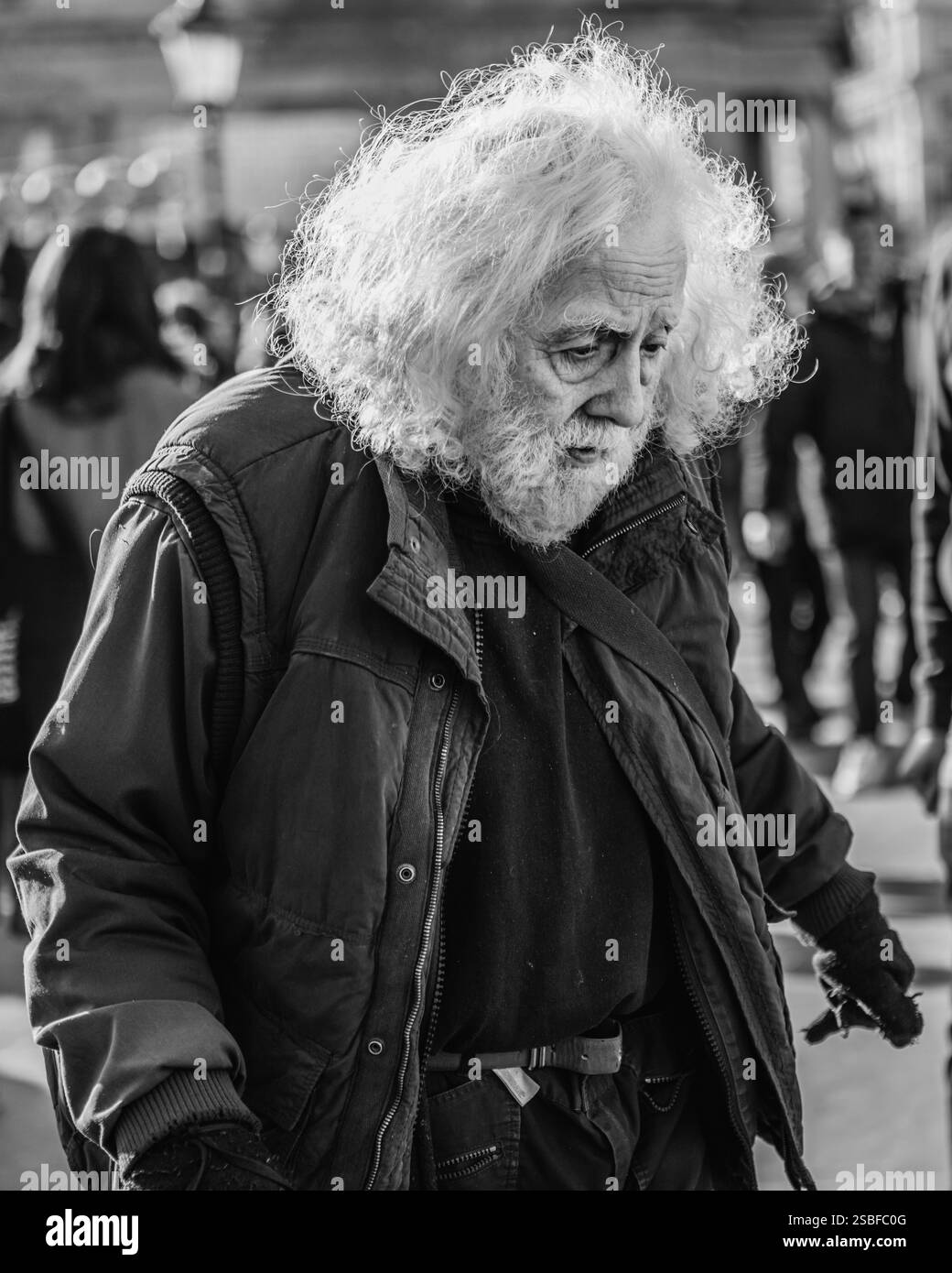 An old man in contemplative mood walks in London Stock Photo - Alamy