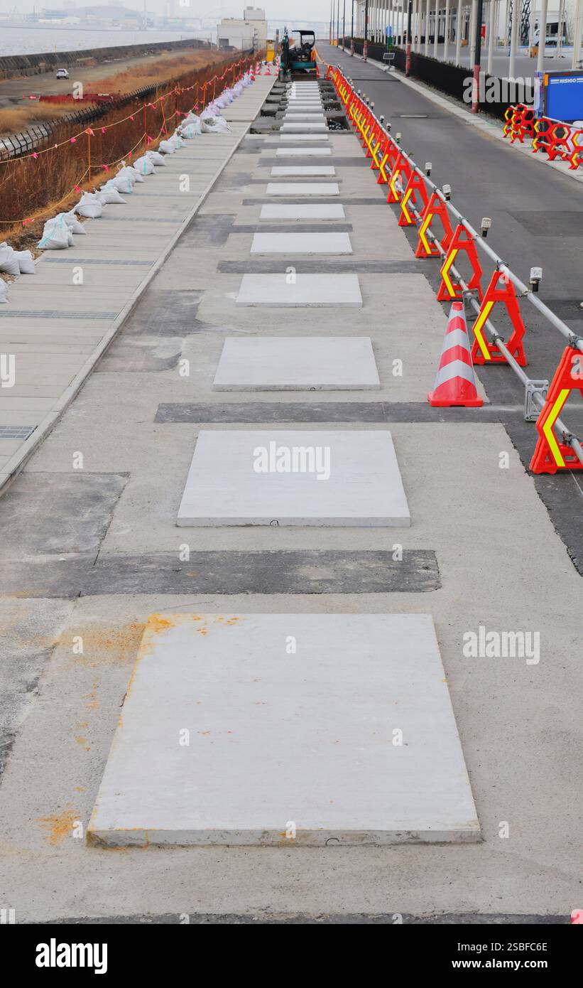 A photo shows a construction site for a system that embeds coils in the ...
