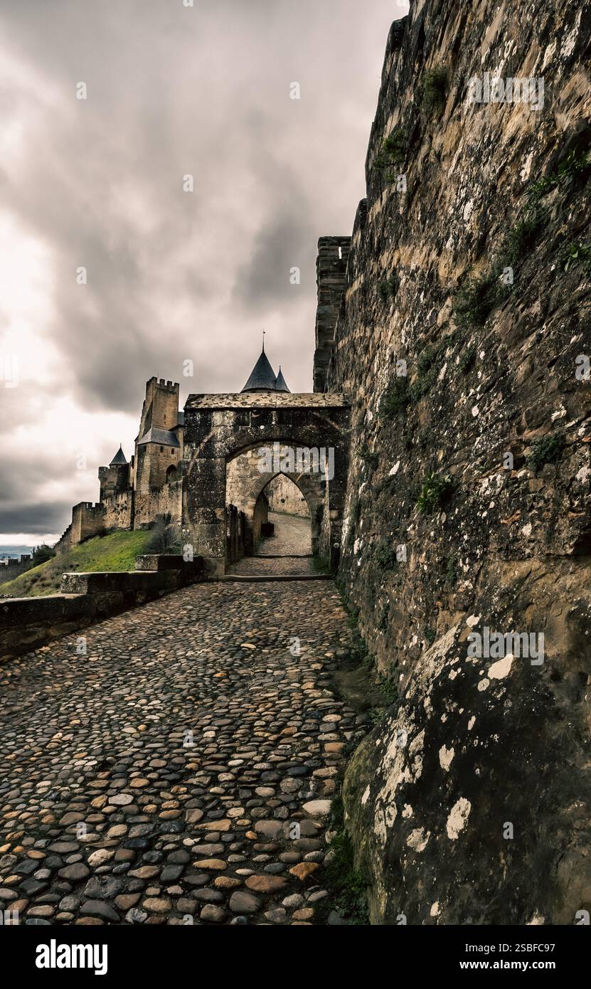 Cobblestone path leading to the historic Aude Gate to enter the ...