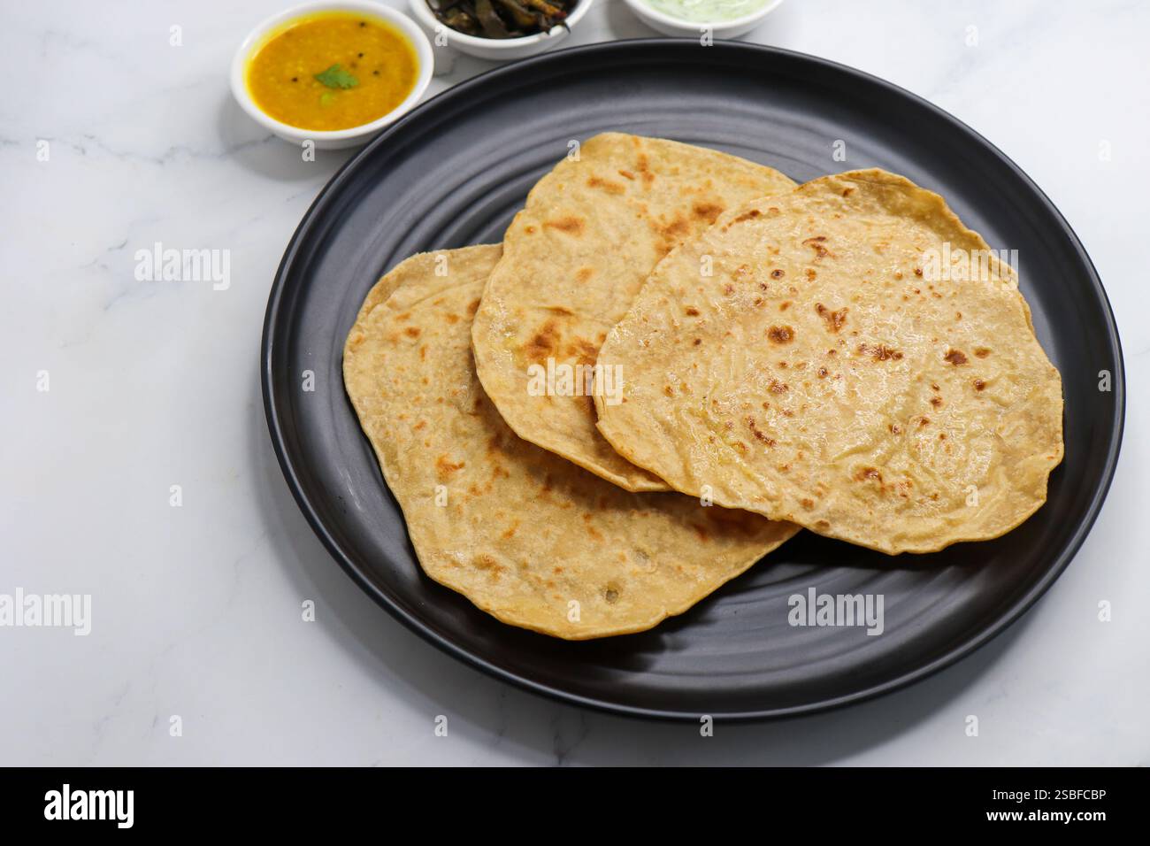 Roti and Sabzi. Indian vegetarian Thali includes bhindi fry, yellow ...