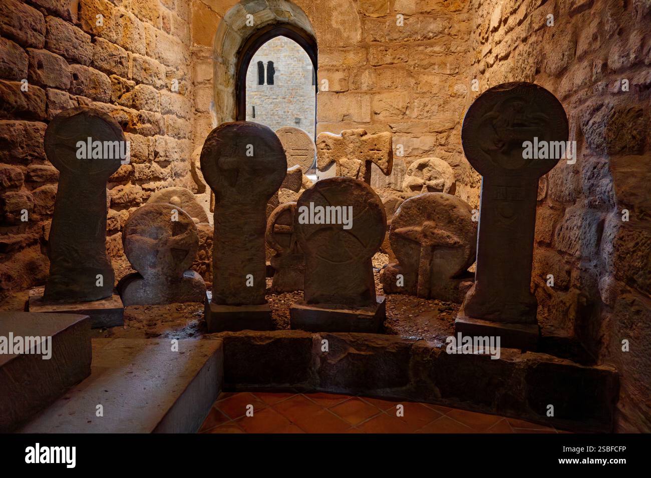 Ancient stone crosses from funerary steles for medieval tombs inside ...