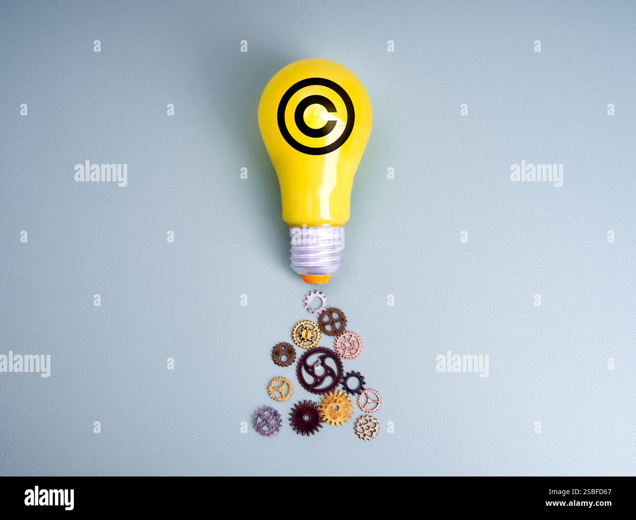 Copyright concept. Copyright symbol on yellow electric light bulb with ...