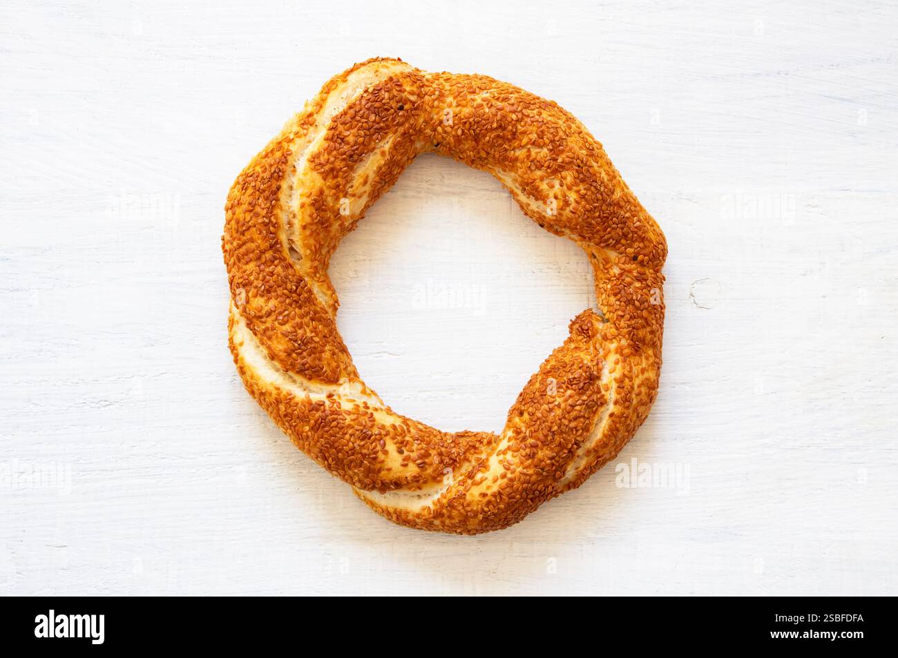 Crispy Turkish traditional bagel / simit with sesame on wooden rustic ...