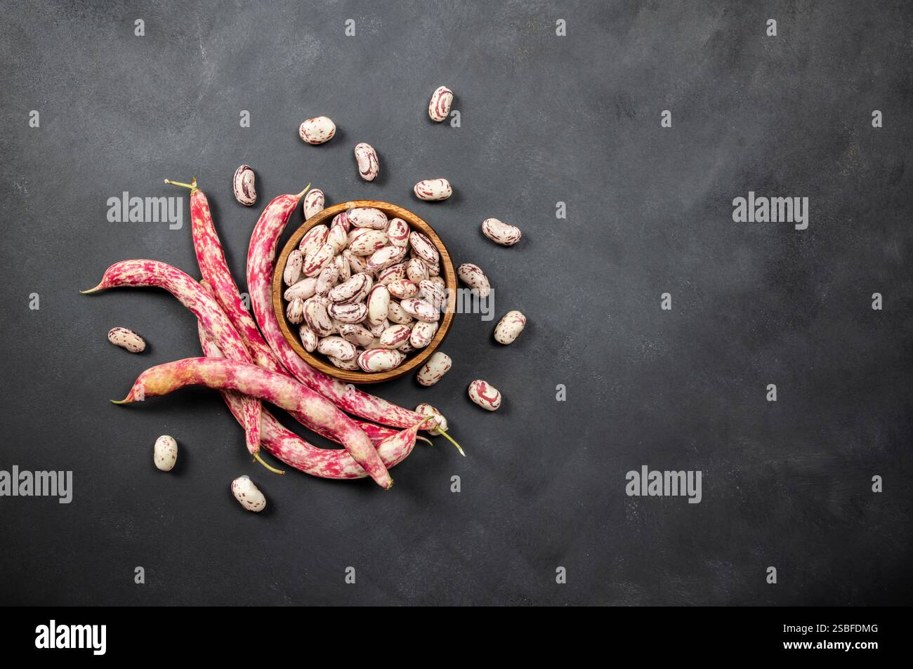 Harvested uncooked dried roman beans with raw pod plant on rustic ...