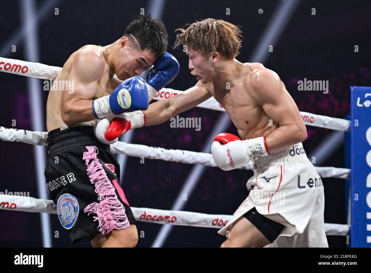 Champion Naoya Inoue (white gloves) of Japan and challenger Kim Ye-joon ...