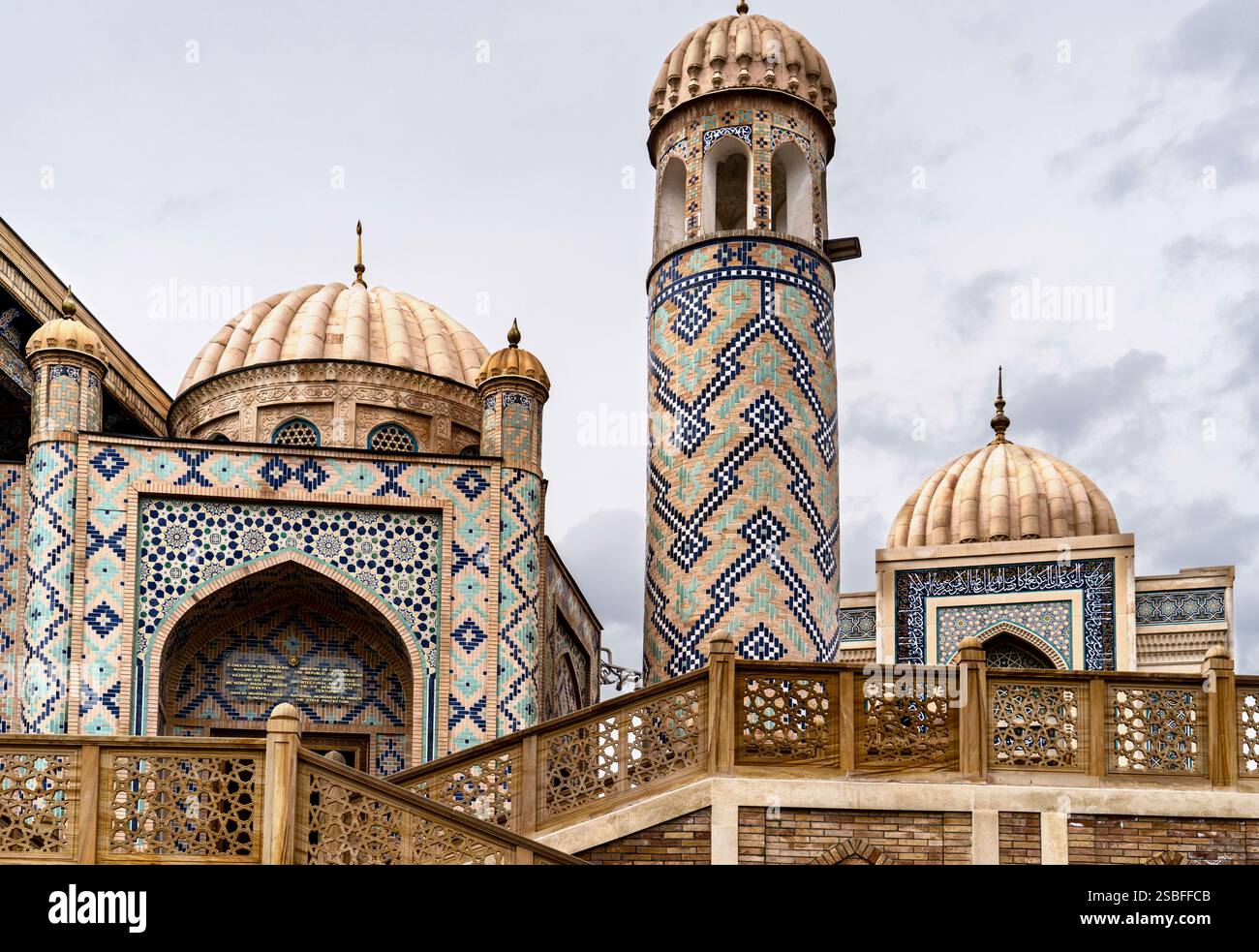 A stunning view of a mosque featuring intricate tile work and domes ...