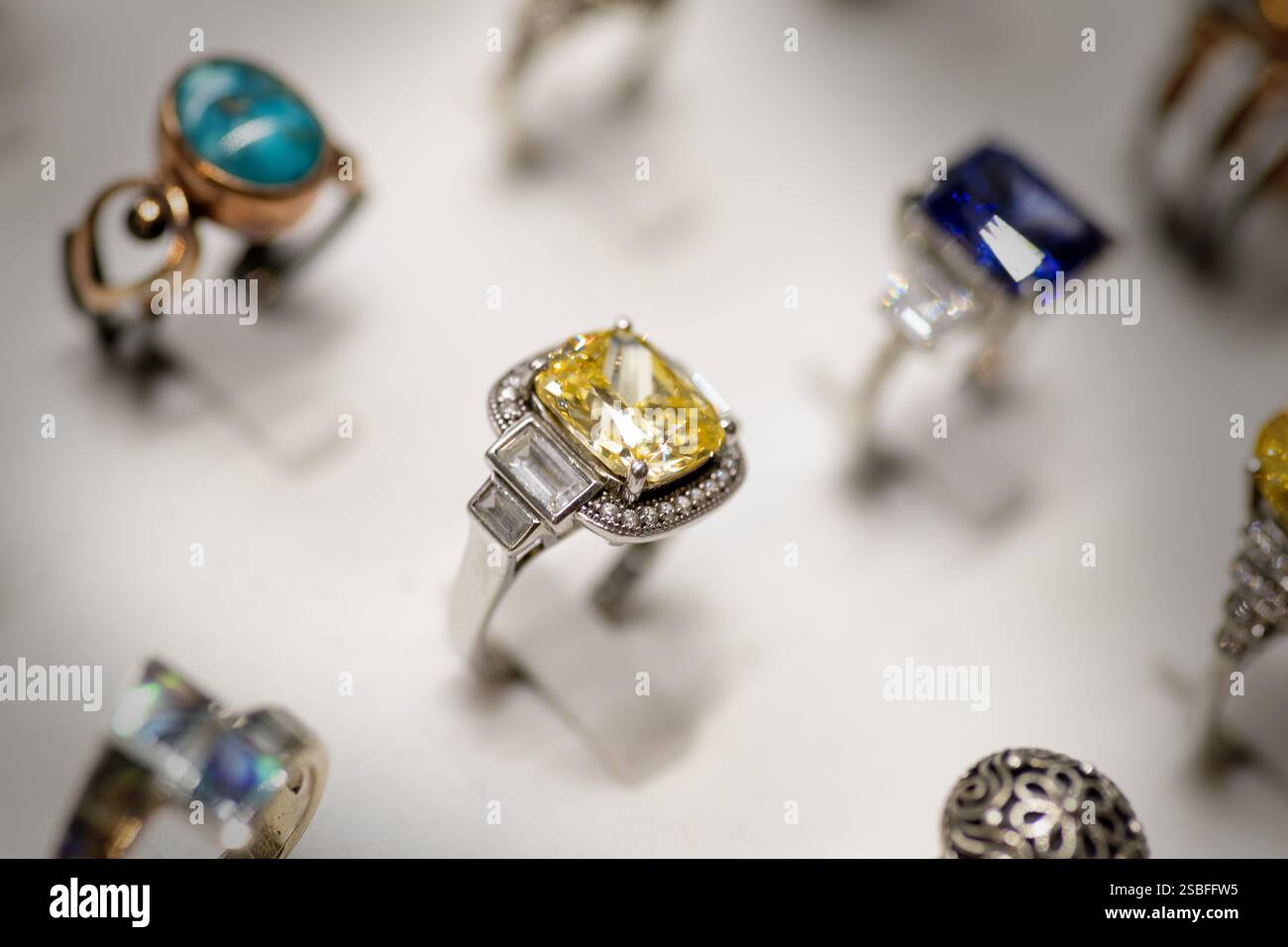 A close-up of multiple gemstone rings with unique designs, elegant ...