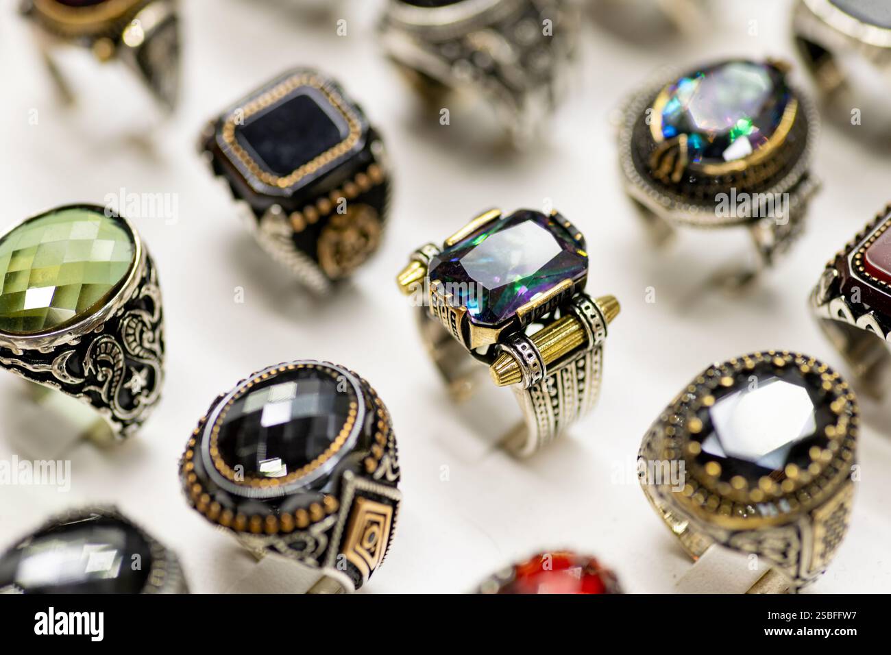 A close-up of multiple gemstone rings with unique designs, elegant ...