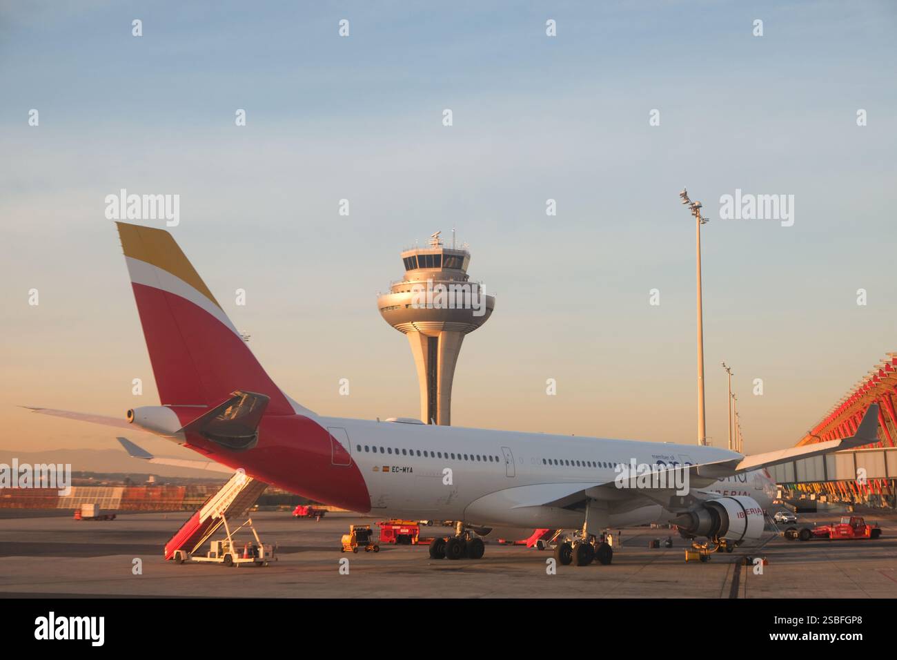 Madrid, Spain. 12 22 2024: A passenger plane with the access stairs ...