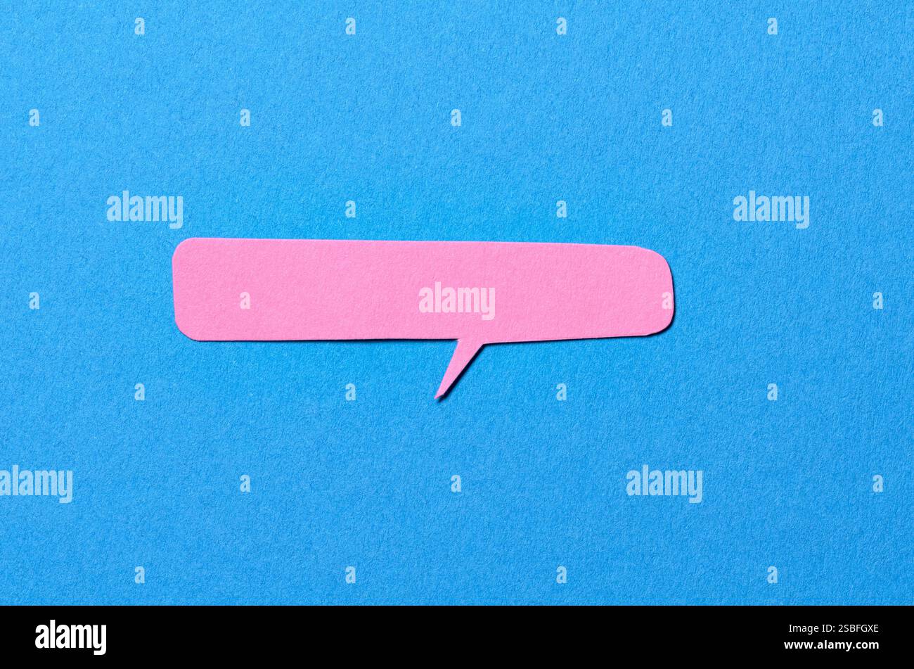 Pink cut out blank paper speech bubble of rectangular shape and rounded ...