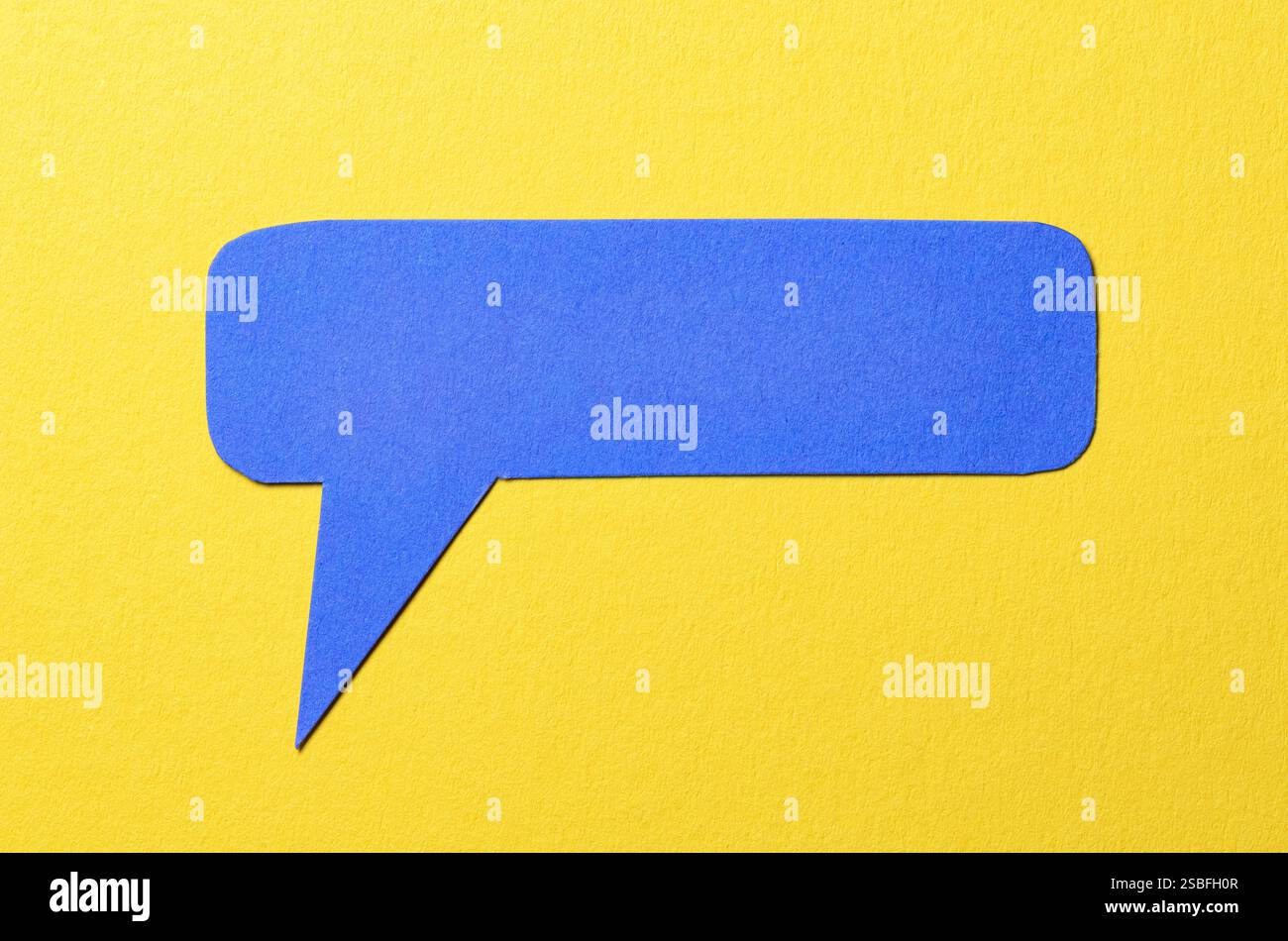 Blue cut out blank paper speech bubble of rectangular shape and rounded ...